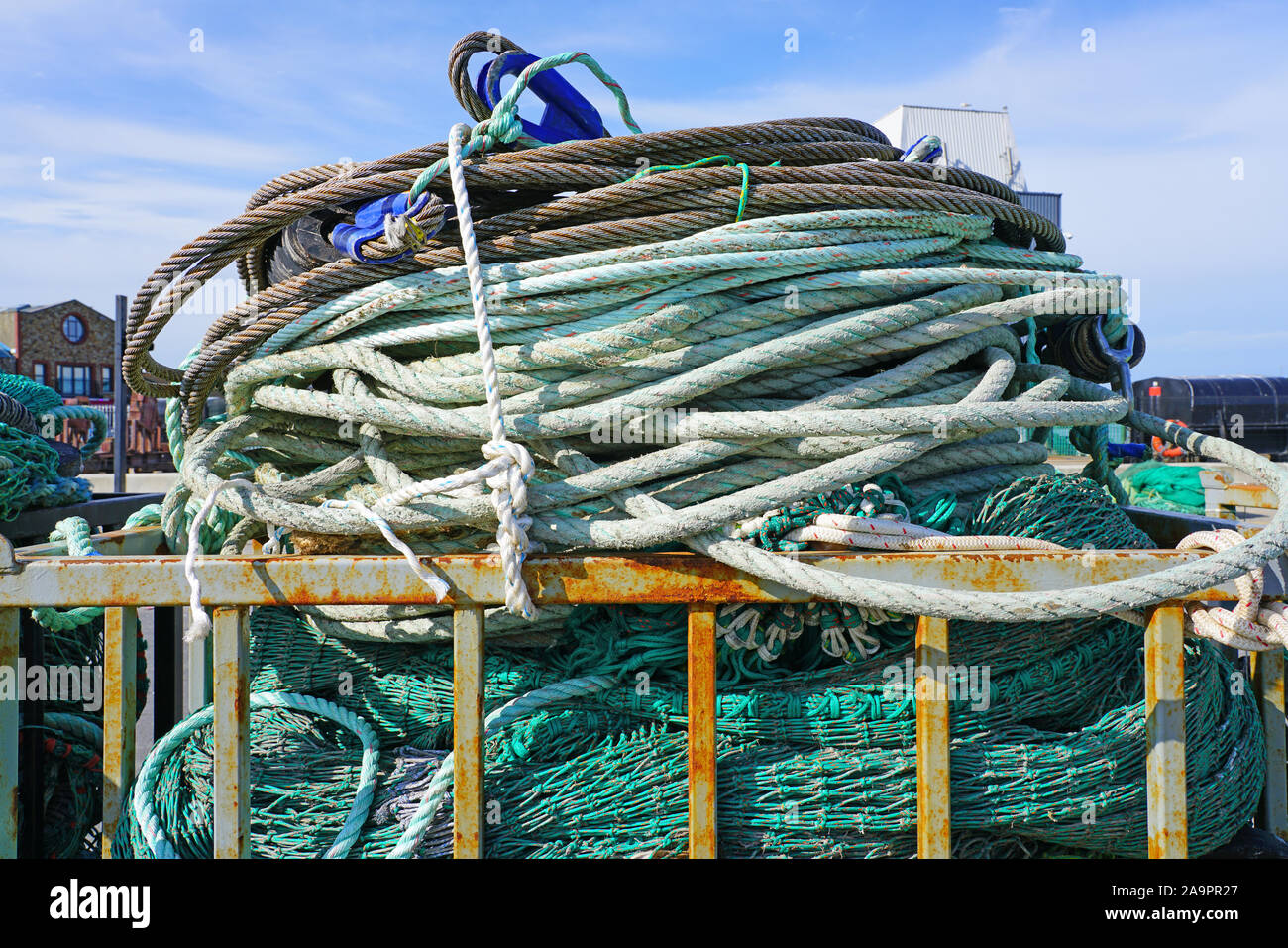 Colorful rope fishing nets in a port Stock Photo - Alamy