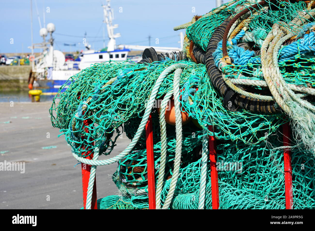 Colorful rope fishing nets in a port Stock Photo - Alamy