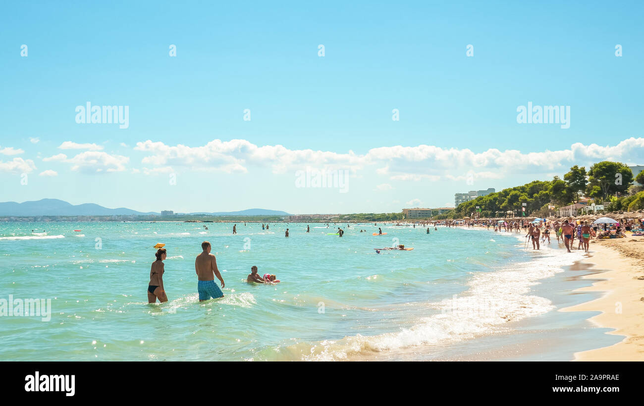 Alcudia, Spain 14.09.2011 - People swimming in sea and sunbathing at ...