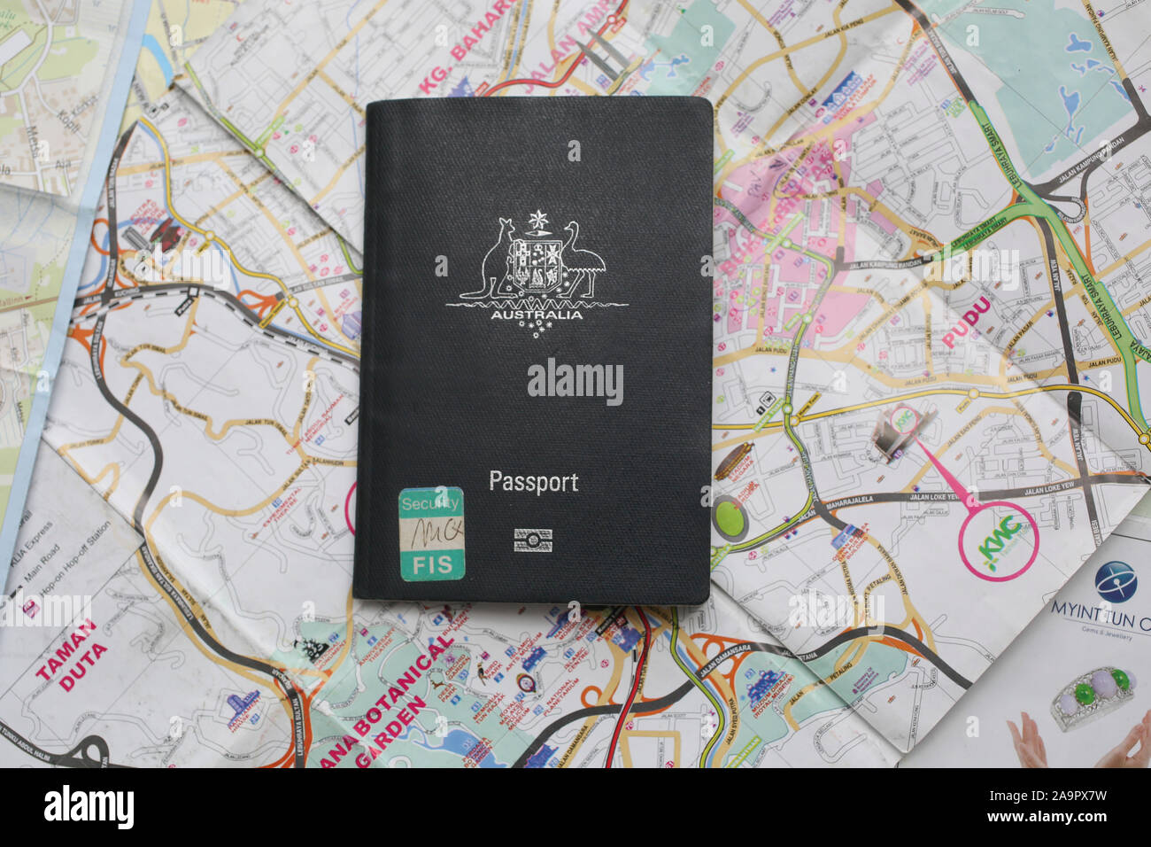 Australian passport on travel maps Stock Photo - Alamy