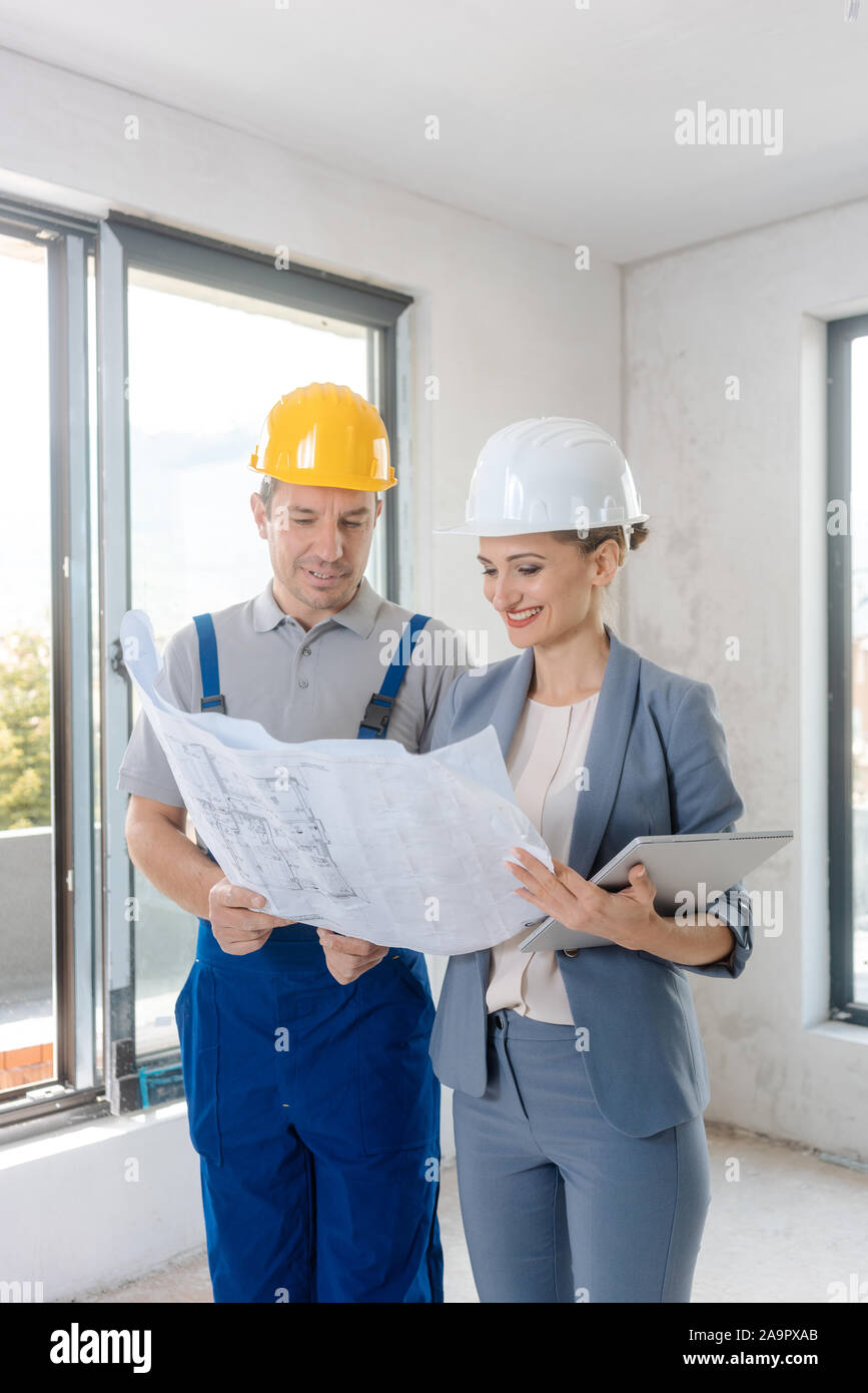 Project owner and construction worker during acceptance Stock Photo - Alamy