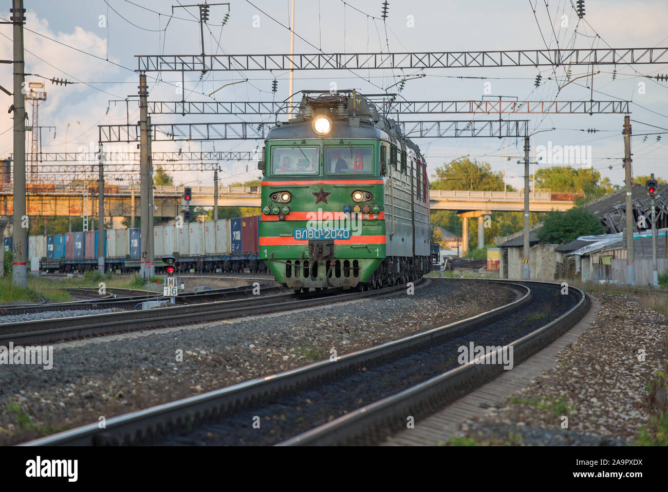 SHARYA, RUSSIA - JULY 03, 2019: Green VL80S electric locomotive with a ...