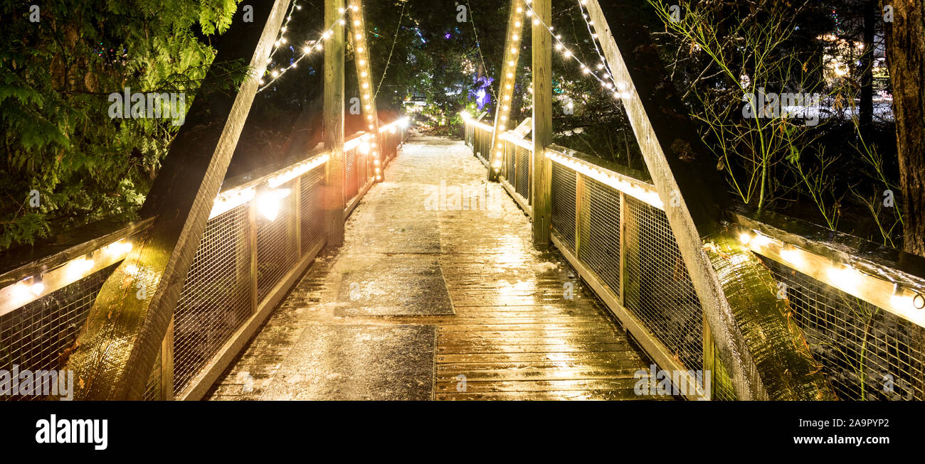 Outdoor string Christmas lights on the bridge, winter wonderland Stock ...