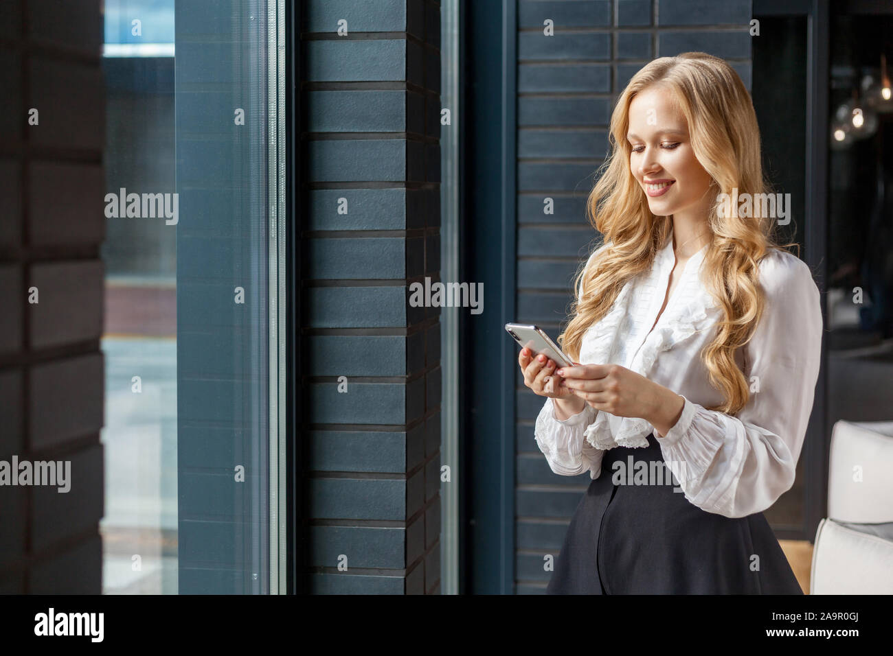 Attractive business woman happily using hi-res stock photography and ...