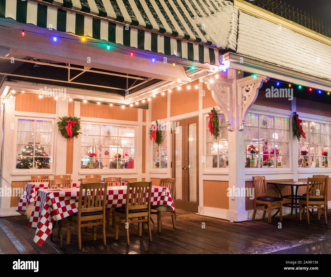 Christmas decorated store front in the historic part of town at night ...