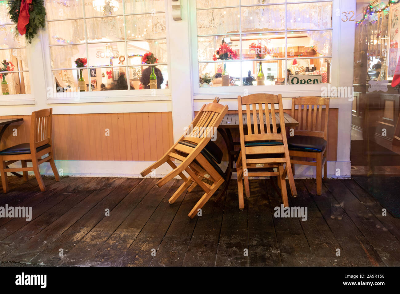 Christmas decorated store front in the historic part of town at night ...