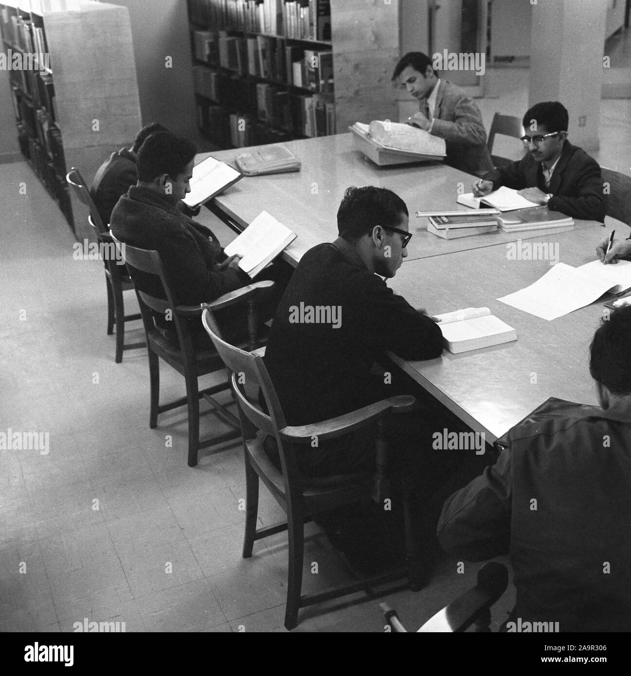 1960s, historical, Arab students studying in a library, Saudi Arabia ...