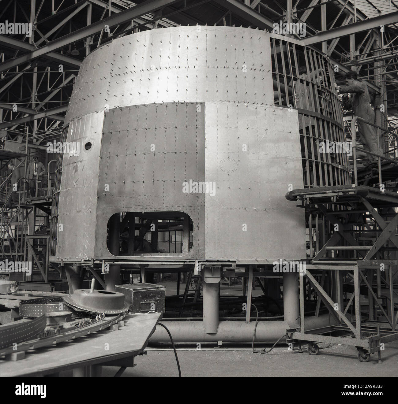 1950s, historical, aviation, part of an aircraft being assembled by ...