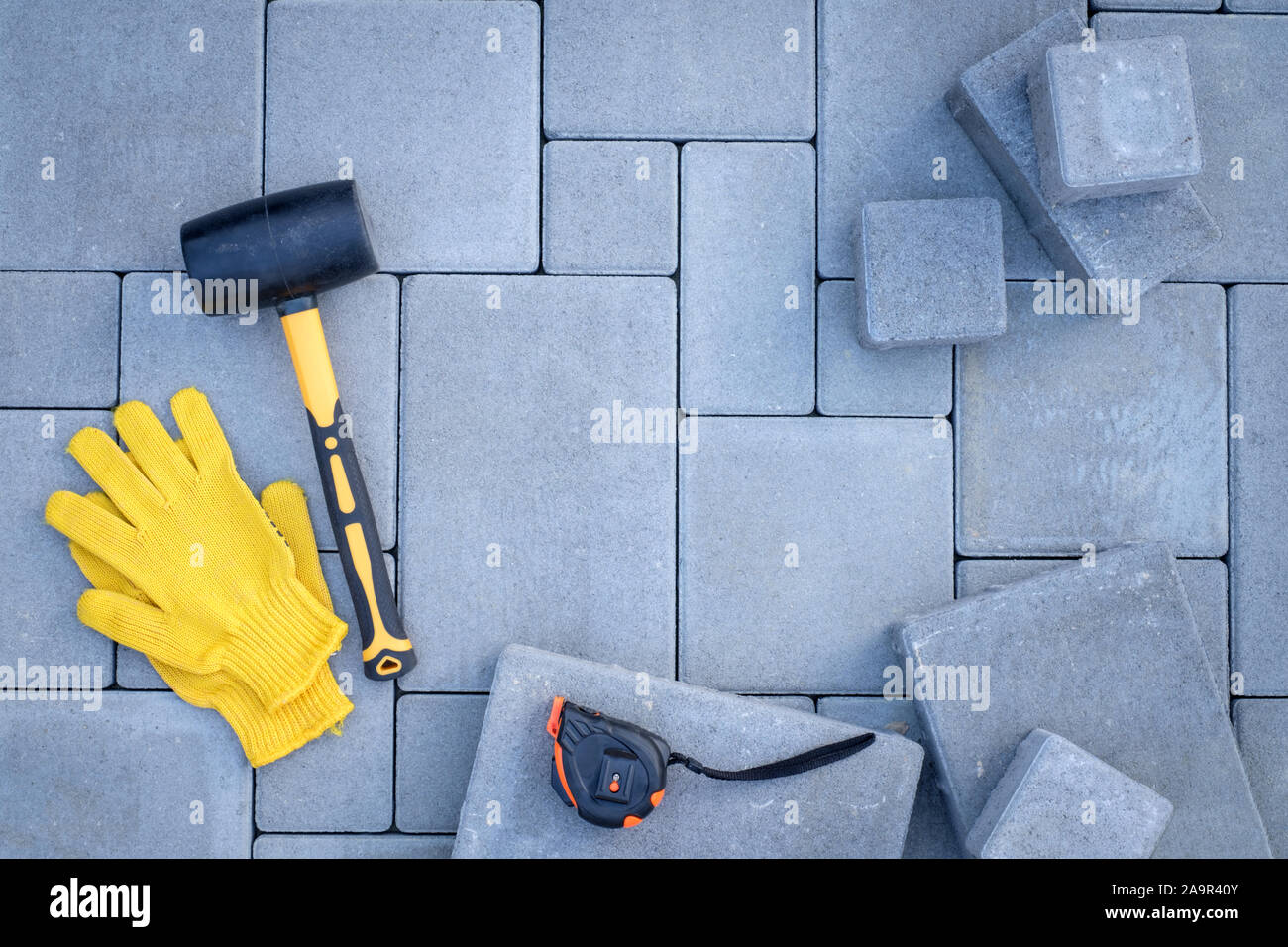 Paving stones paving background. Installing tools on foreground Stock ...