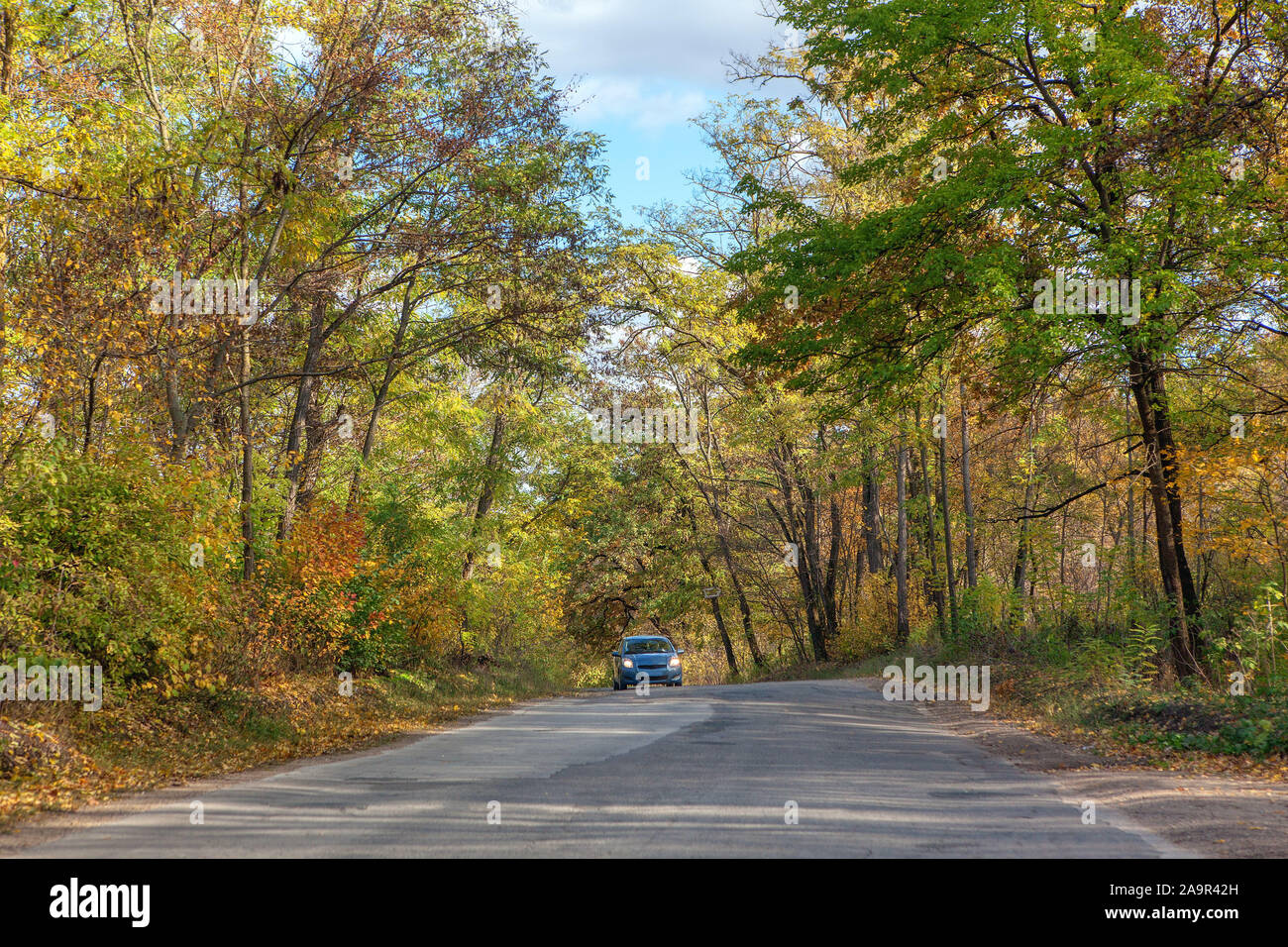 driving car on the autumn road Stock Photo - Alamy
