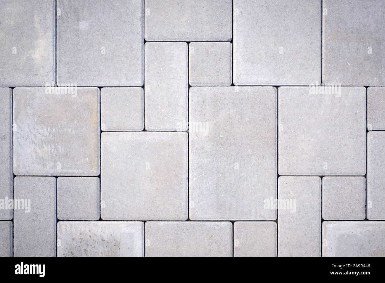 Laying gray concrete paving stones on house courtyard Stock Photo - Alamy