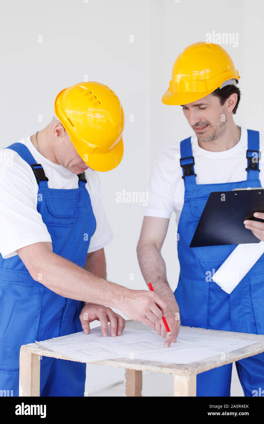 Building, construction, development, teamwork and people concept ...