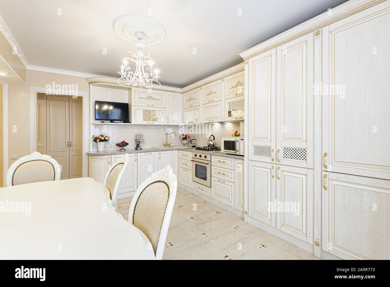 Luxury modern beige and cream colored kitchen interior Stock Photo - Alamy