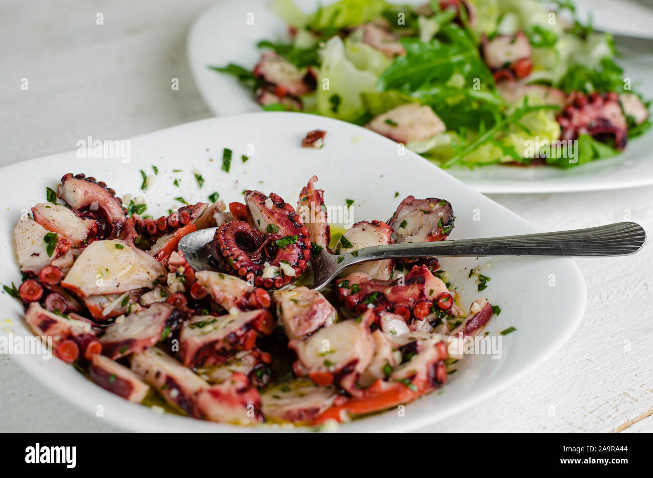 Seafood appetizer. Octopus salad cooking process. Mediterranean ...