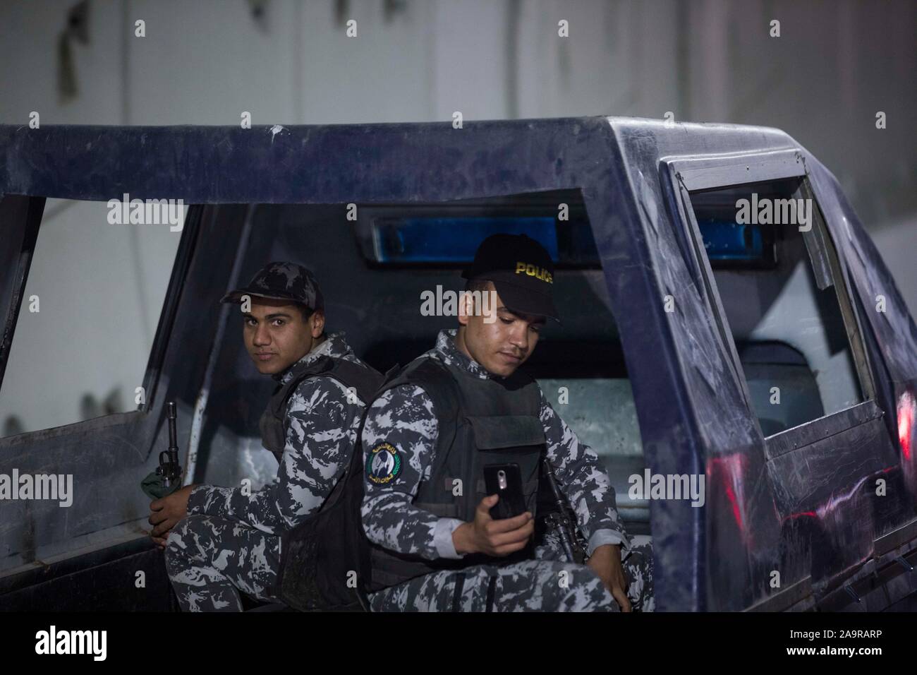 Ismailia, Egypt. 17th Nov, 2019. Two police soldiers sit inside a ...