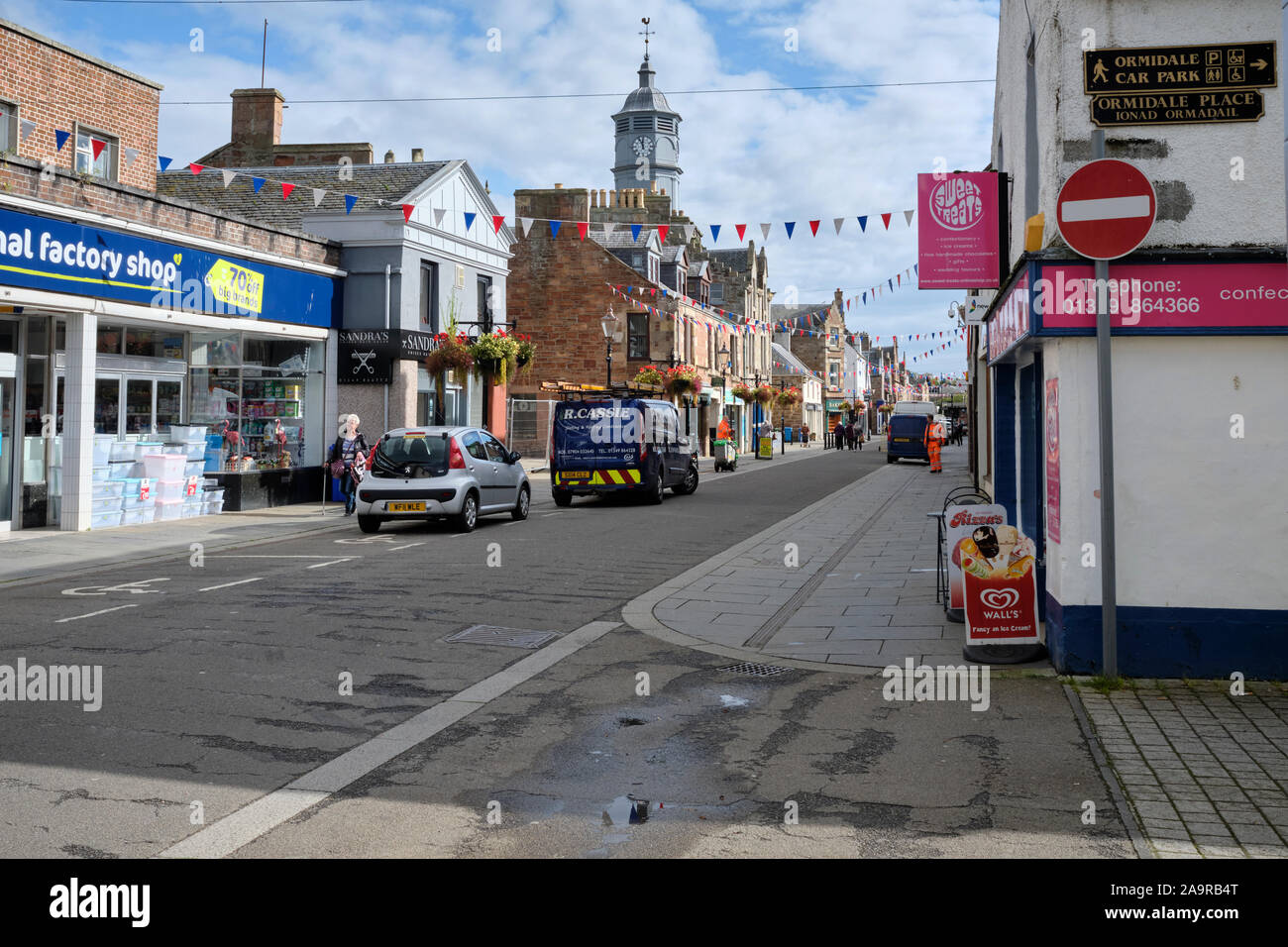 View of the main street with shop fronts and bunting at Dingwall. 26/09 ...