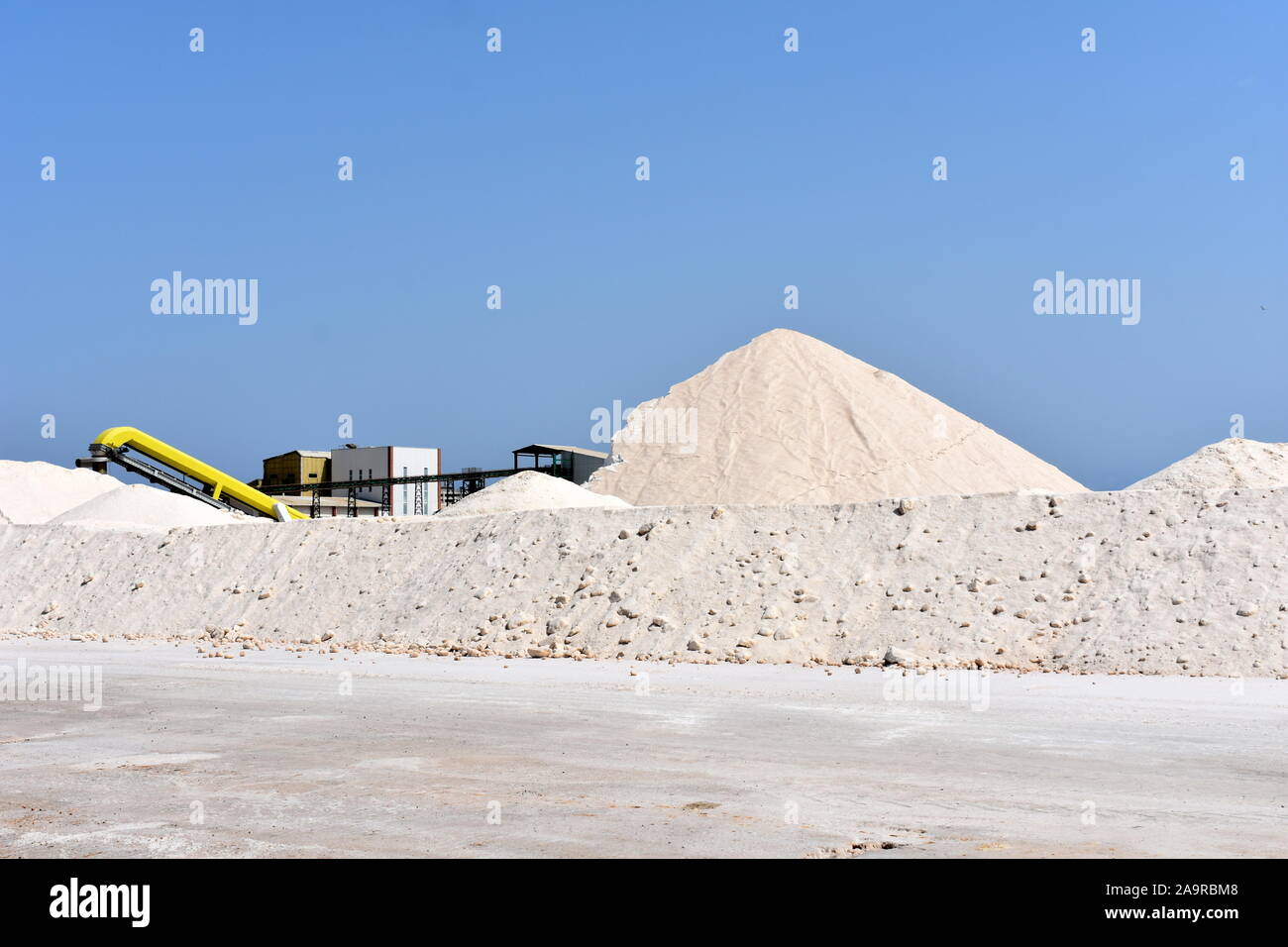 Salt mountains and machinery at the Torrevieja salt works, Torrevieja ...