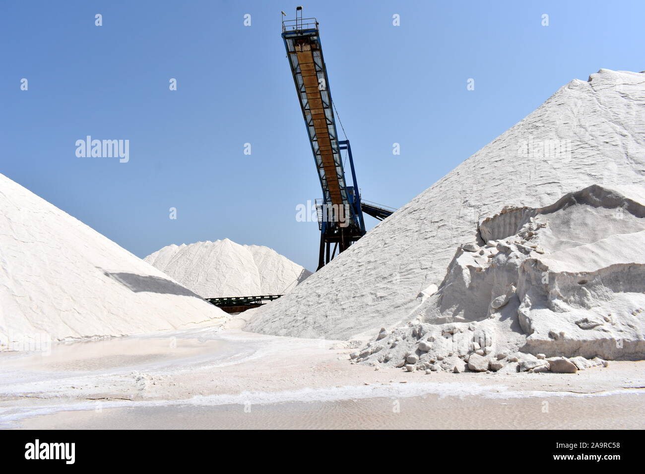 Salt mountains and machinery at the Torrevieja salt works, Torrevieja ...