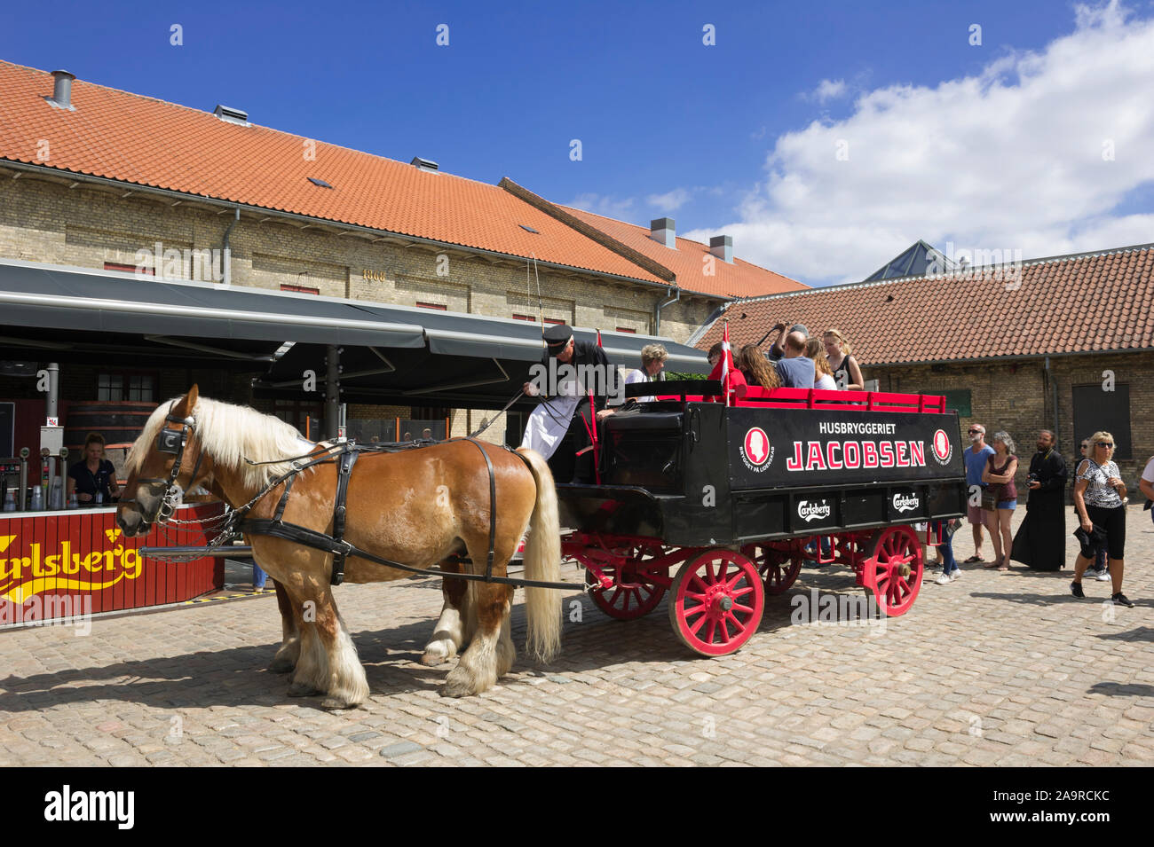Visitors in a horse drawn cart at the Carlsberg Brewery, Copenhagen ...