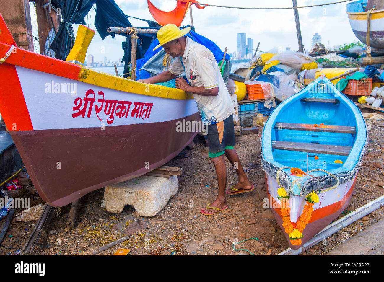 Indian man working in a fishermen village near Mumbai India Stock Photo ...