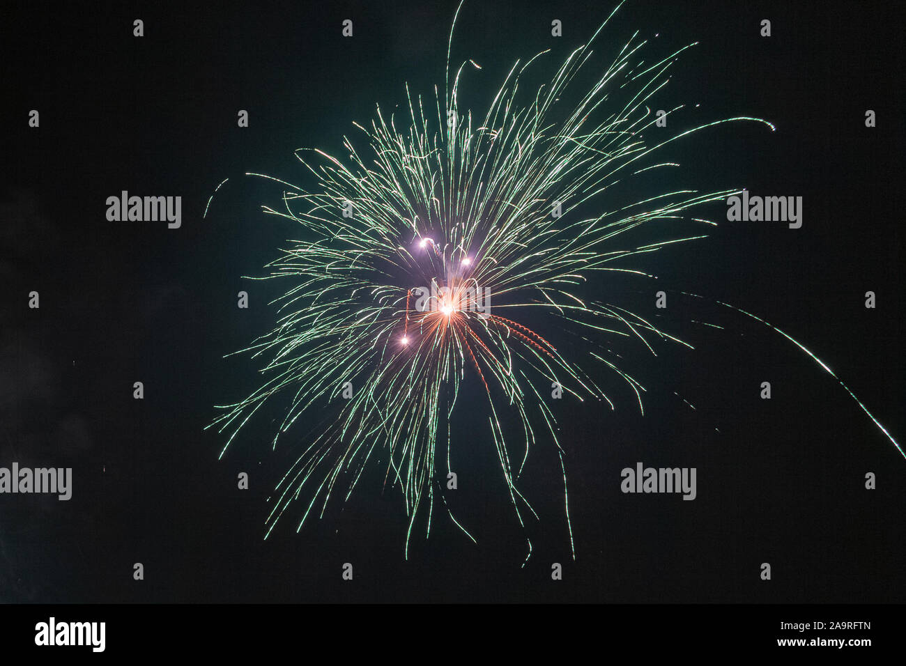 Awesome green and orange fireworks against the backdrop of the night ...