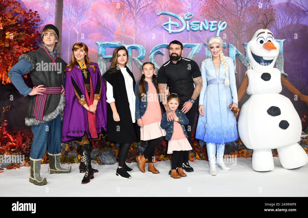 Ant Middleton (centre) and family with characters from the film ...