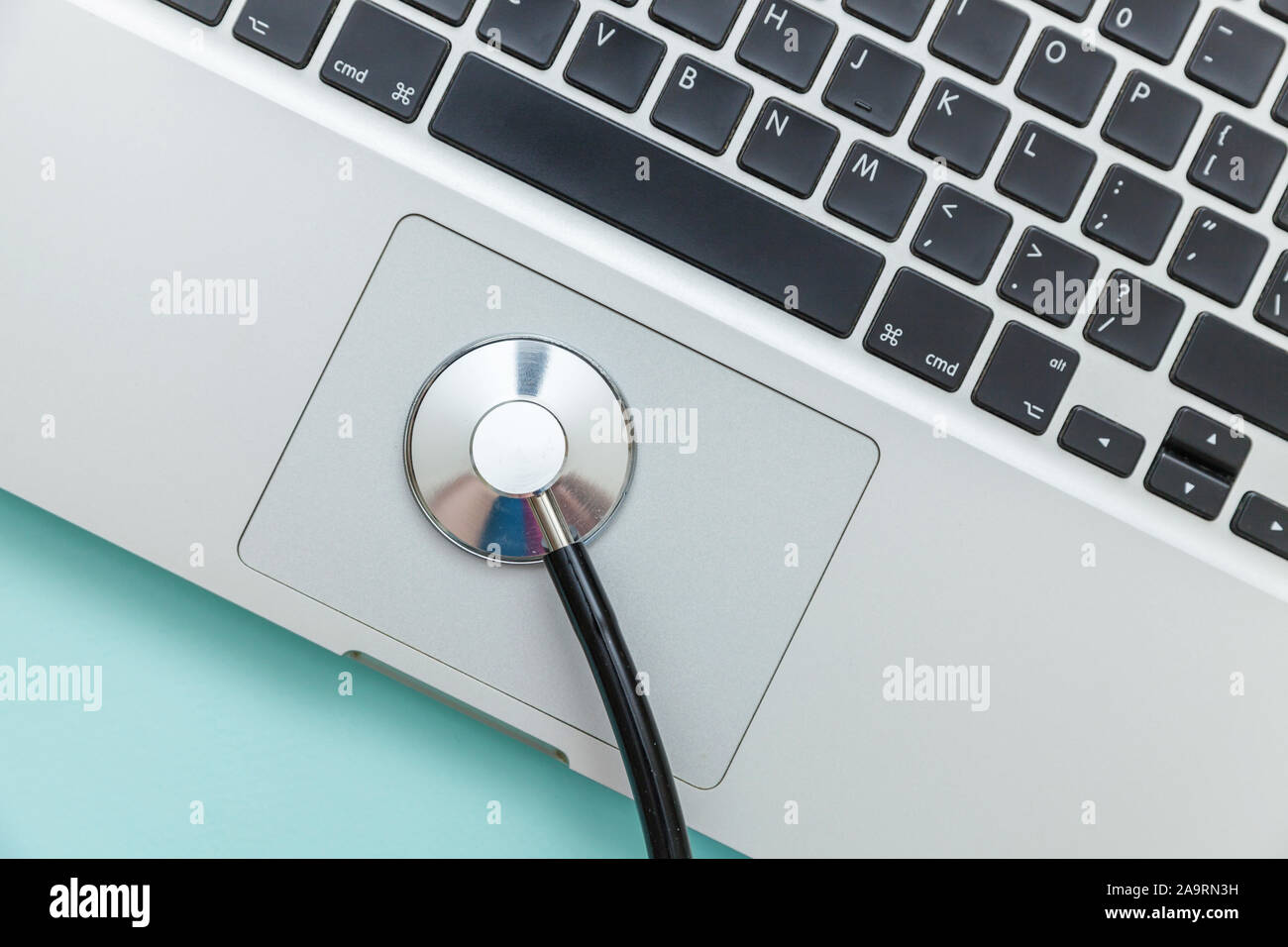 Stethoscope keyboard laptop computer isolated on blue background ...