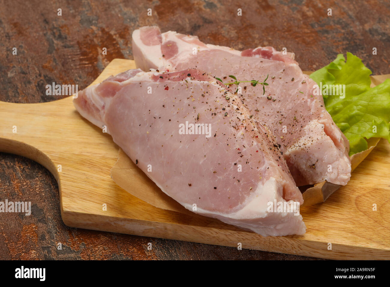 Raw pork meat steak ready for grill Stock Photo - Alamy