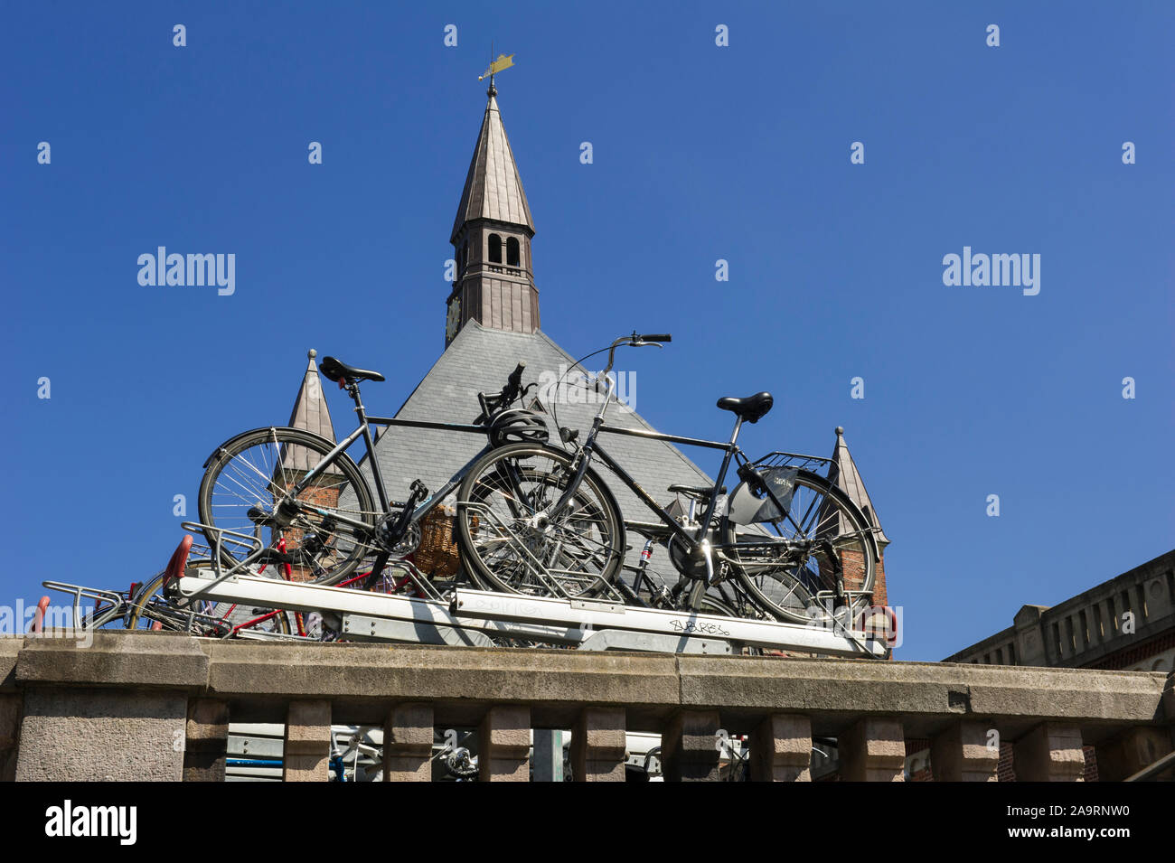 Bicycles in bicycle racks outside the train station in Copenhagen ...