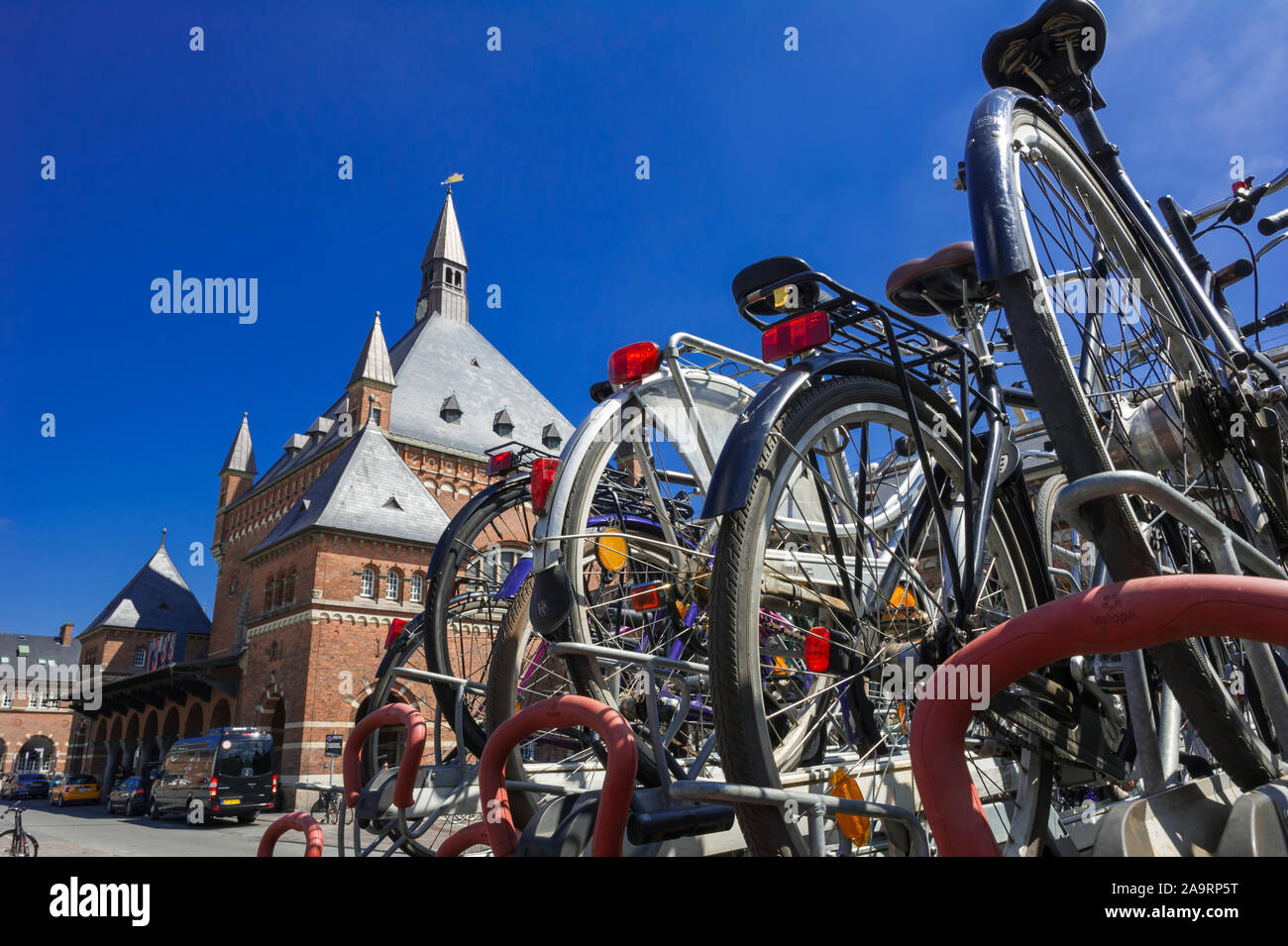 Bicycles in bicycle racks outside the train station in Copenhagen ...