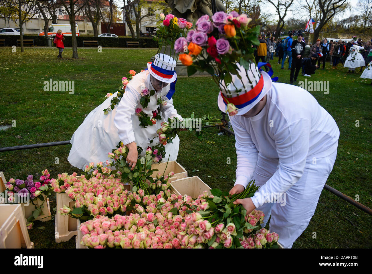 Actors distribute flowers during the 30th anniversary of the Velvet ...