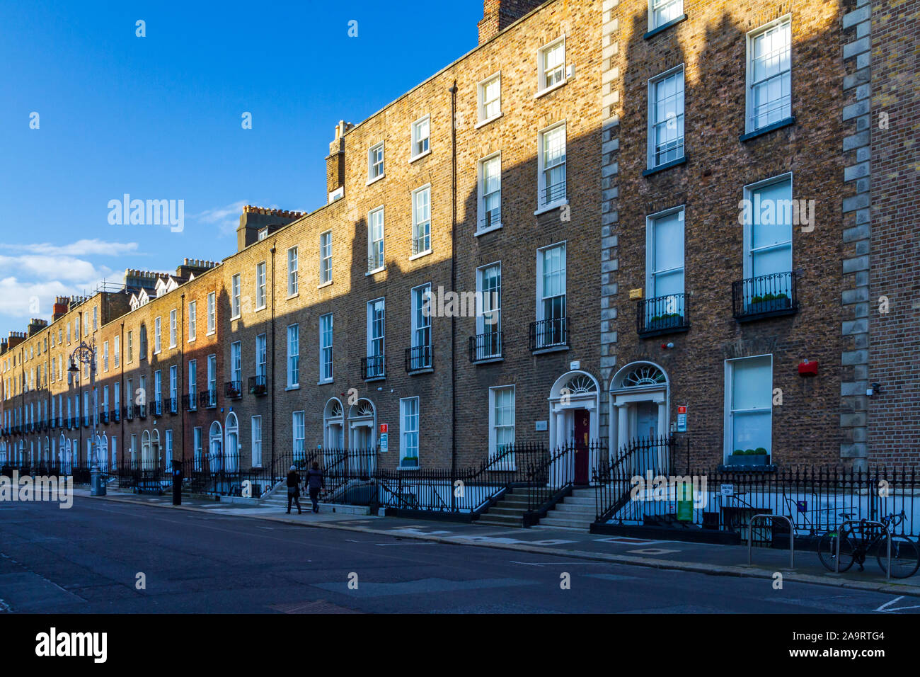 Terrace of Georgian houses with shadow reflection of opposite terrace ...