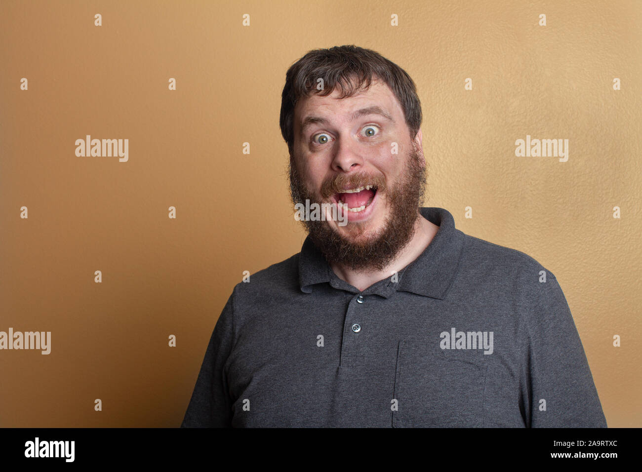 Big smile on a man but you can tell it's fake Stock Photo - Alamy