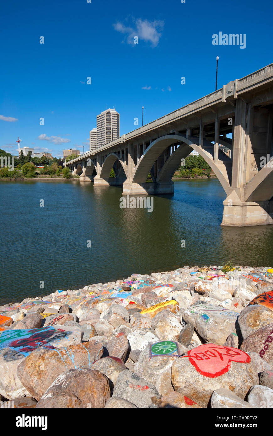 Painted rocks and Broadway bridge crossing the South Saskatchewan river ...