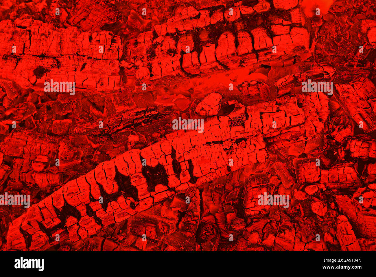 Firewood background with smoldering charcoal embers in red color, top ...