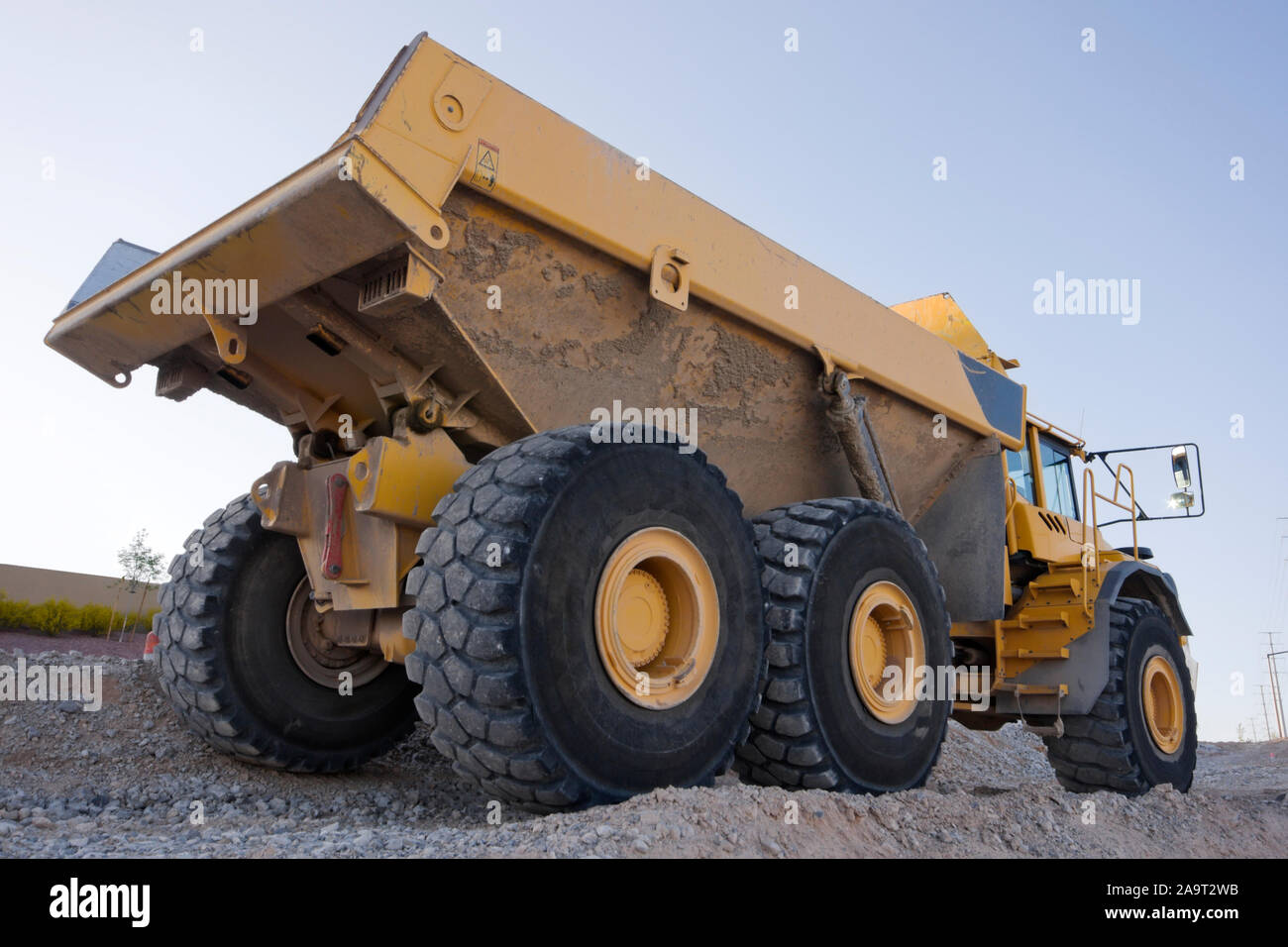 Heavy Construction Equipment Dump Truck against a blue sky Stock Photo ...