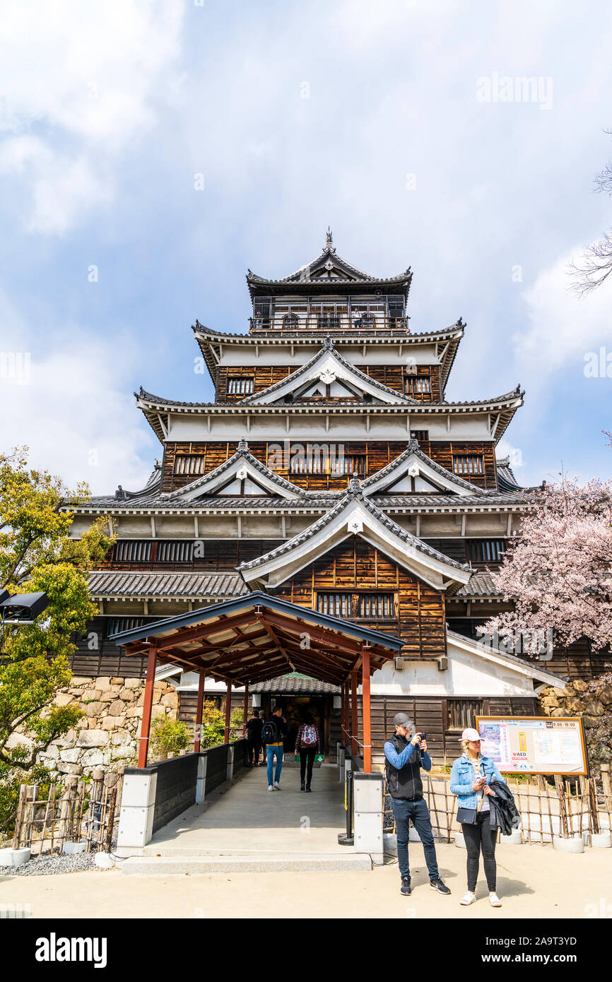 Hiroshima castle in Japan. Springtime with cherry blossoms, the main ...