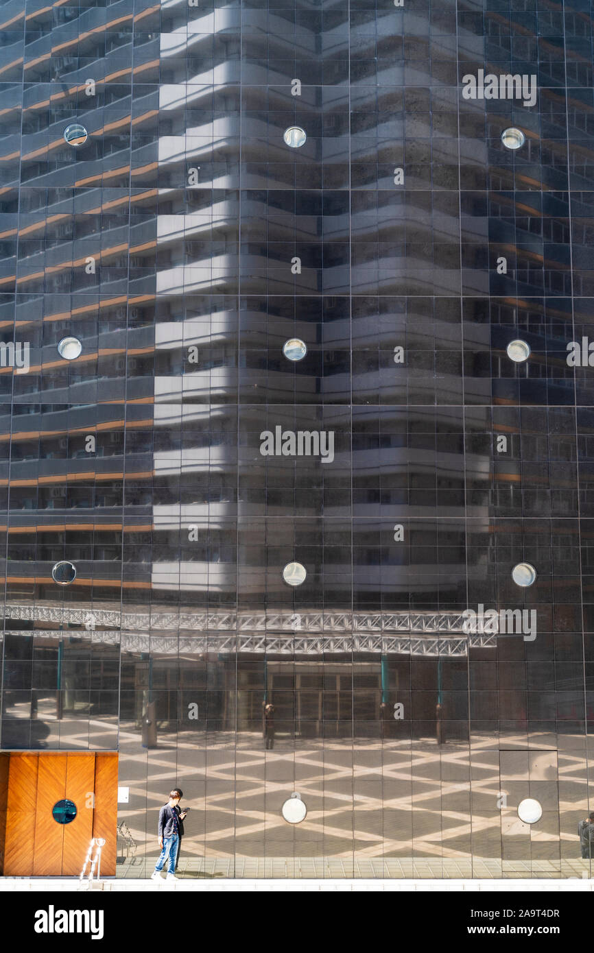 Tokyo, Asahi Beer Hall building. Wooden door entrance in black glassed ...