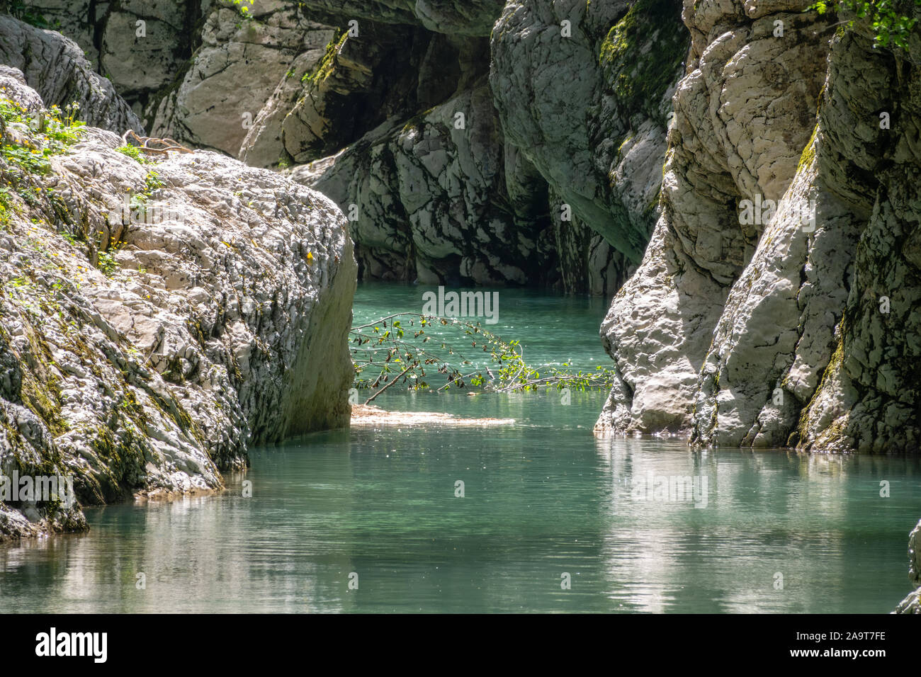 Transparent clear mountain river in a stone gorge. Mountain river with ...