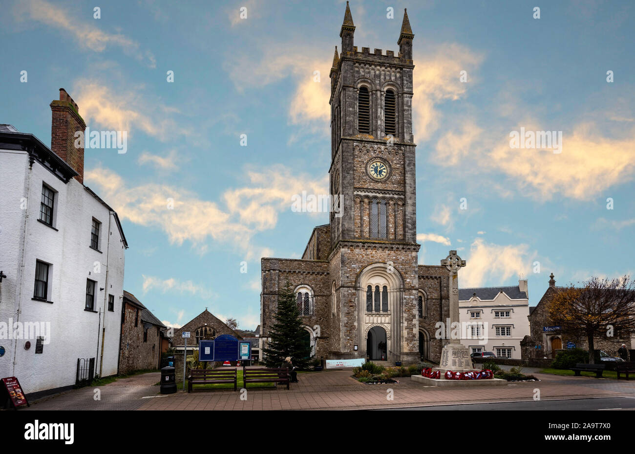 St Pauls Church, Honiton with war memorial cross in Honiton, Devon, UK ...
