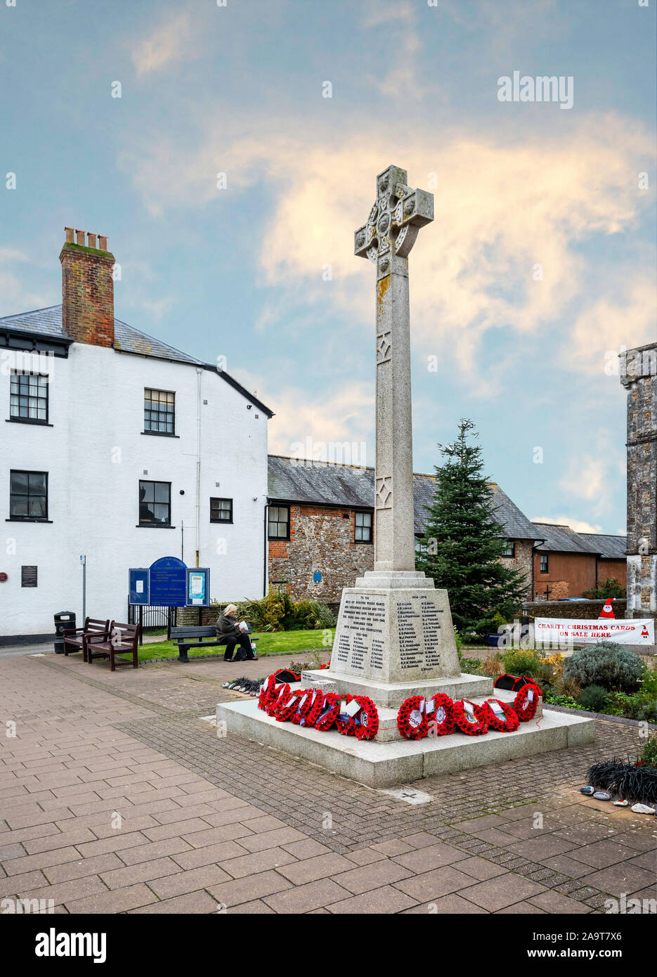 War memorial cross with poppies for remembrance sunday in Honiton ...