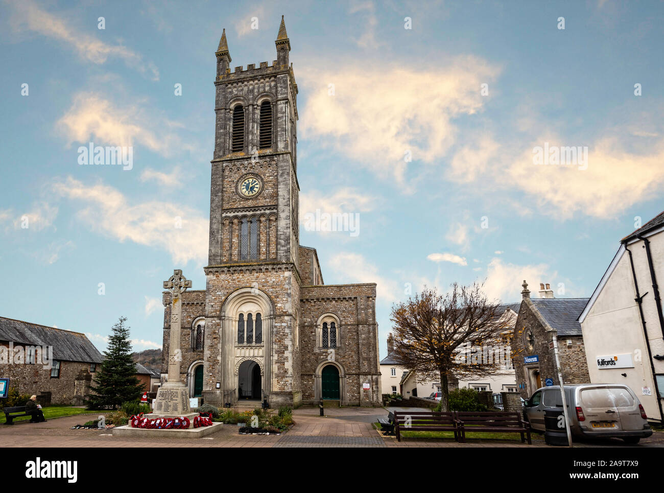 St Pauls Church, Honiton with war memorial cross in Honiton, Devon, UK ...