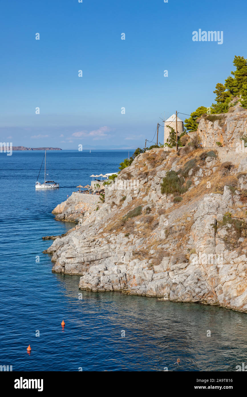 Boat and cliff with Wind mill in Hydra Island, Greece Stock Photo - Alamy