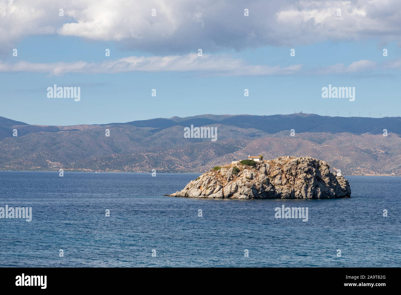 Church in a small island in front of Vlychos Plakes Beach in Hydra ...