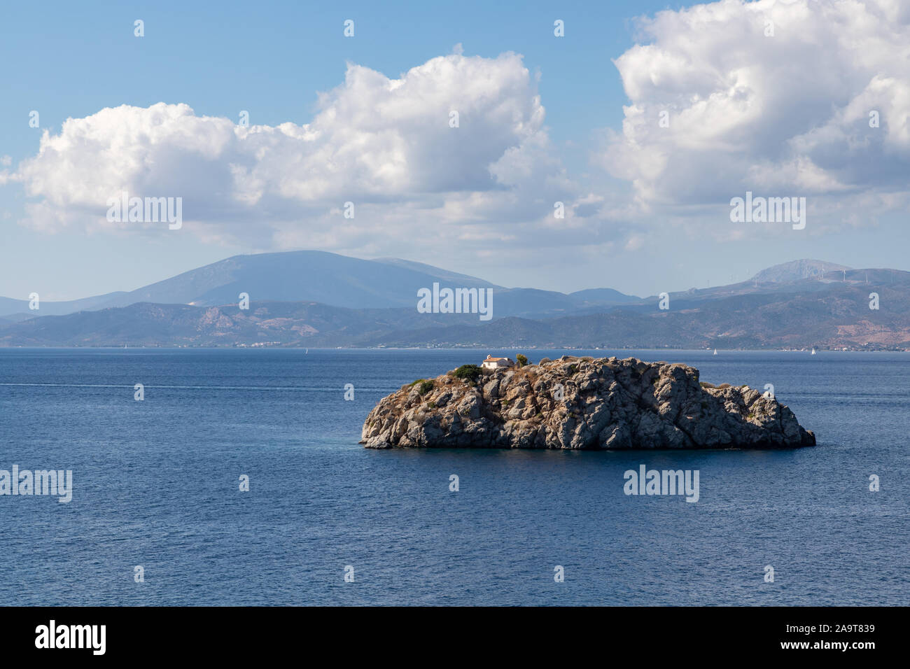 Church in a small island in front of Vlychos Plakes Beach in Hydra ...