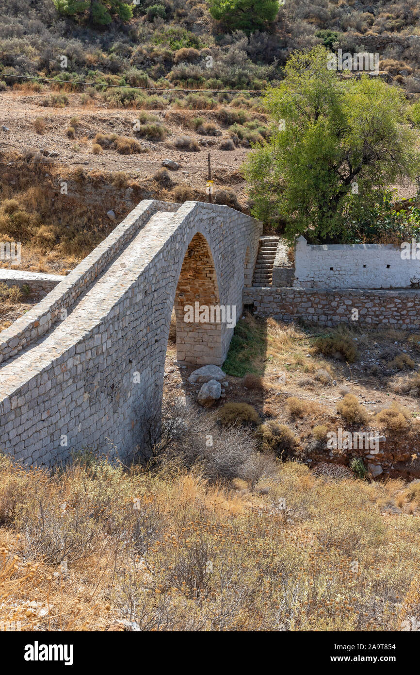 Stone bridge close to Vlychos Beach in Hydra Island, Greece Stock Photo ...