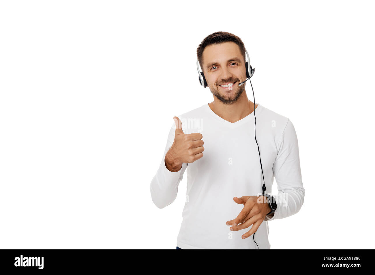 Call center worker man isolated on white background. Young smiling ...