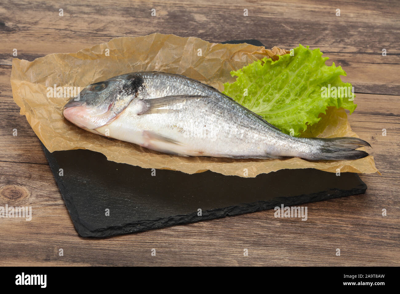 Raw Dorada fish ready for cooking Stock Photo - Alamy
