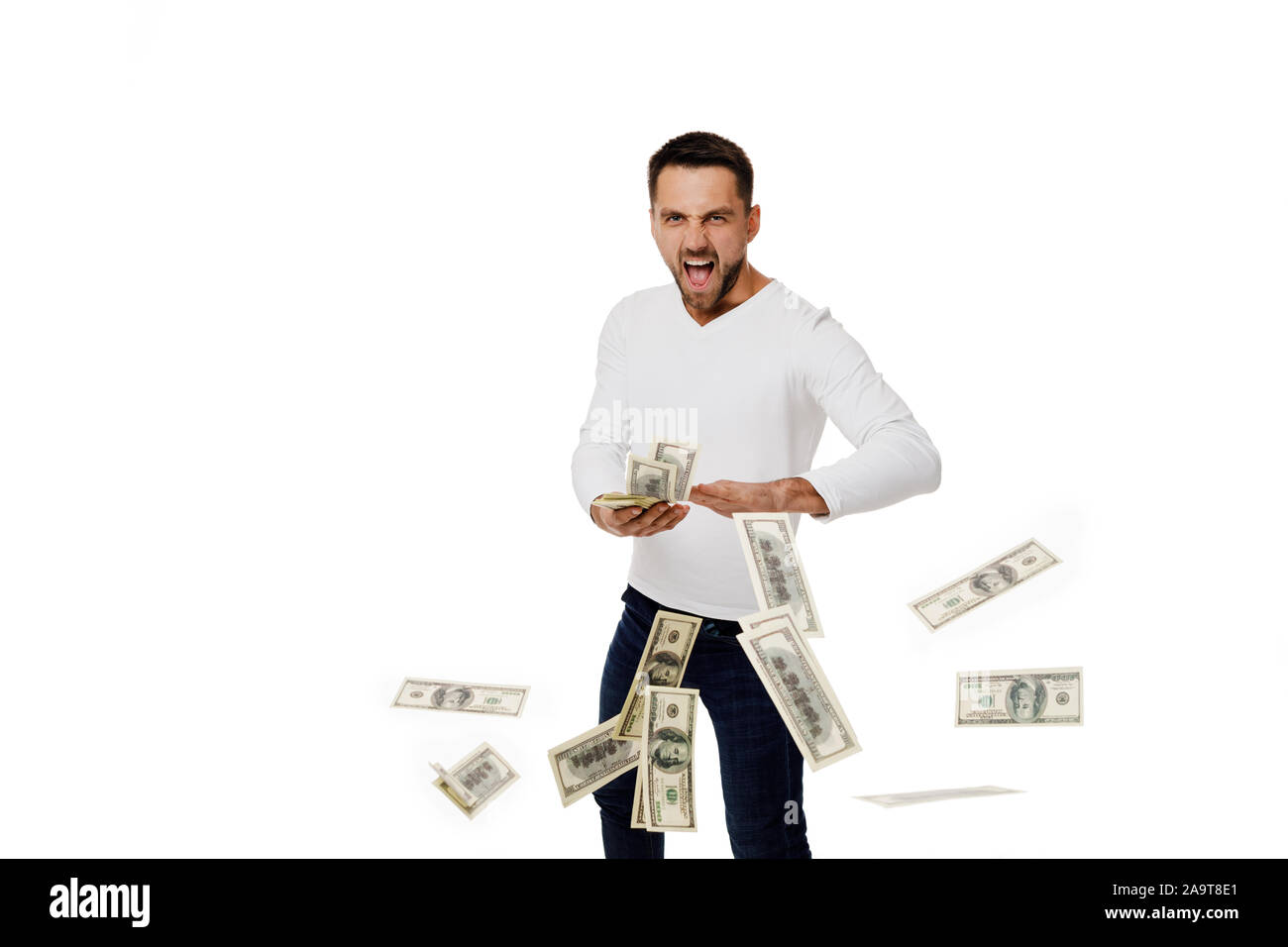 young man throwing money banknotes at camera isolated on white ...