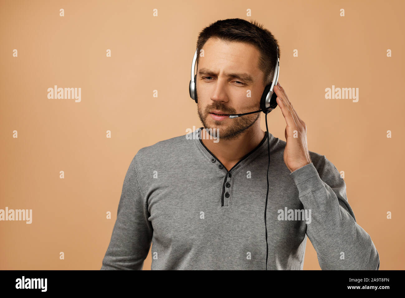 Friendly man listens to customer hi-res stock photography and images ...